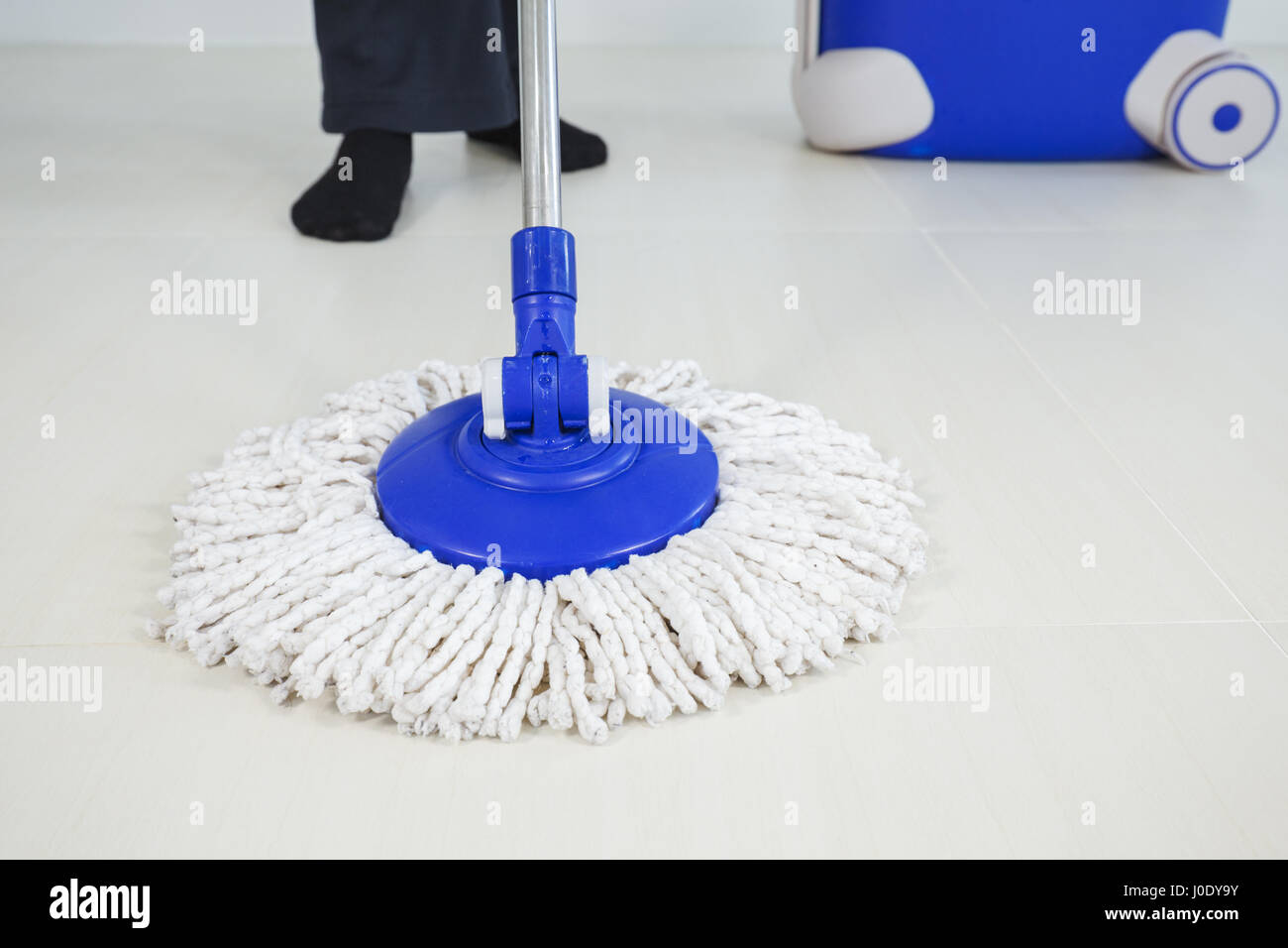 woman legs with mop and bucket cleaning floor at home Stock Photo - Alamy