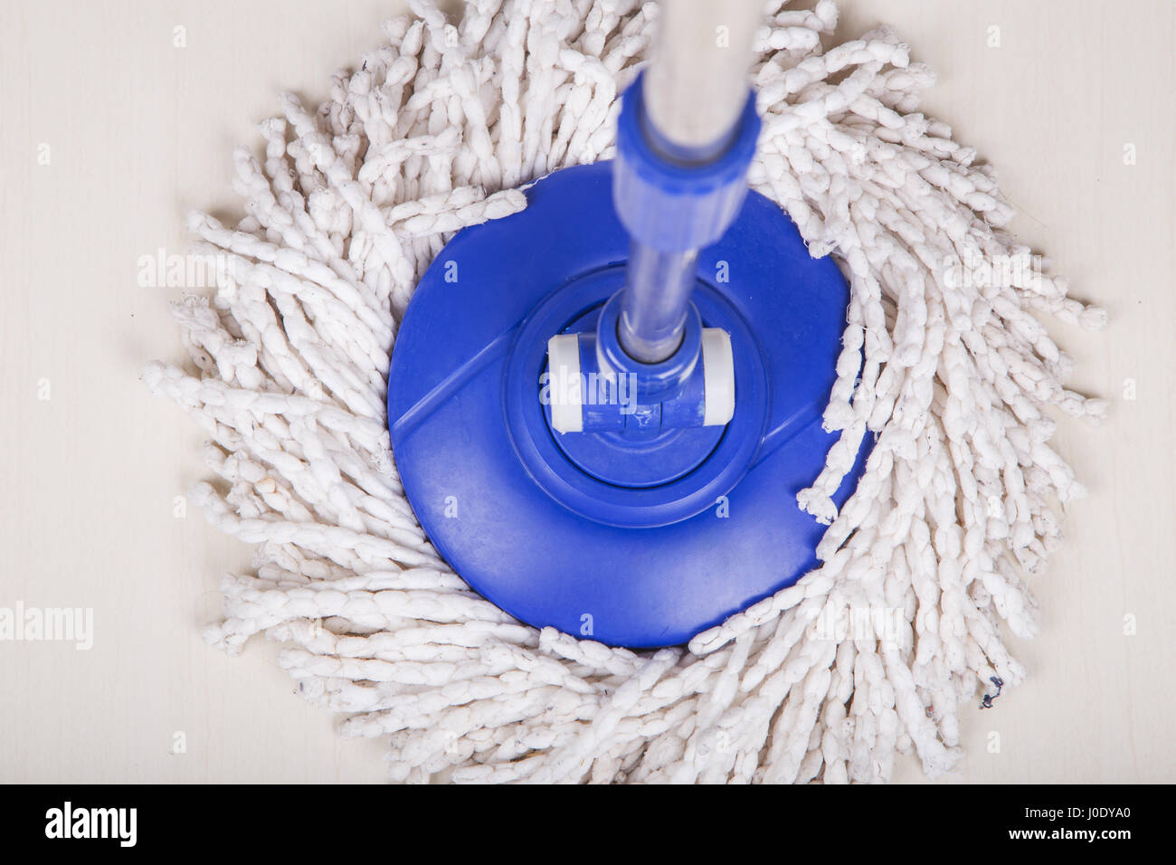 mop for cleaning with the floor background Stock Photo - Alamy