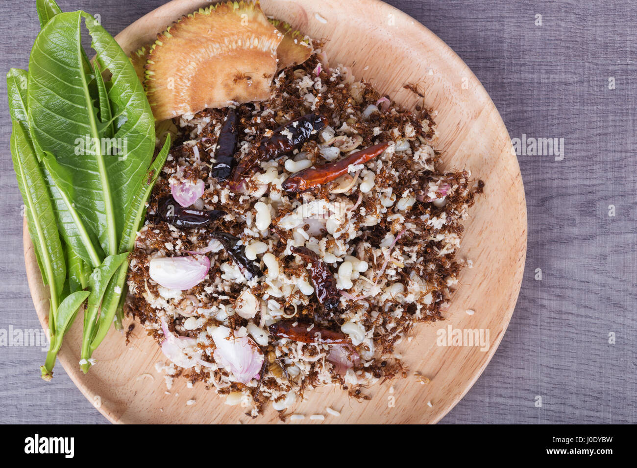 Ant Eggs Spicy Salad with Herbs on wood background Stock Photo - Alamy