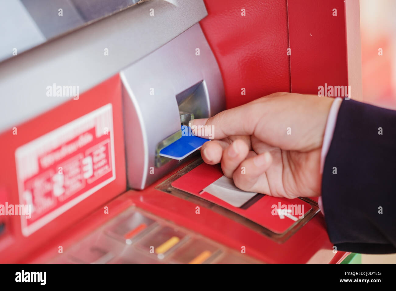 business hand puts credit card into ATM Stock Photo - Alamy