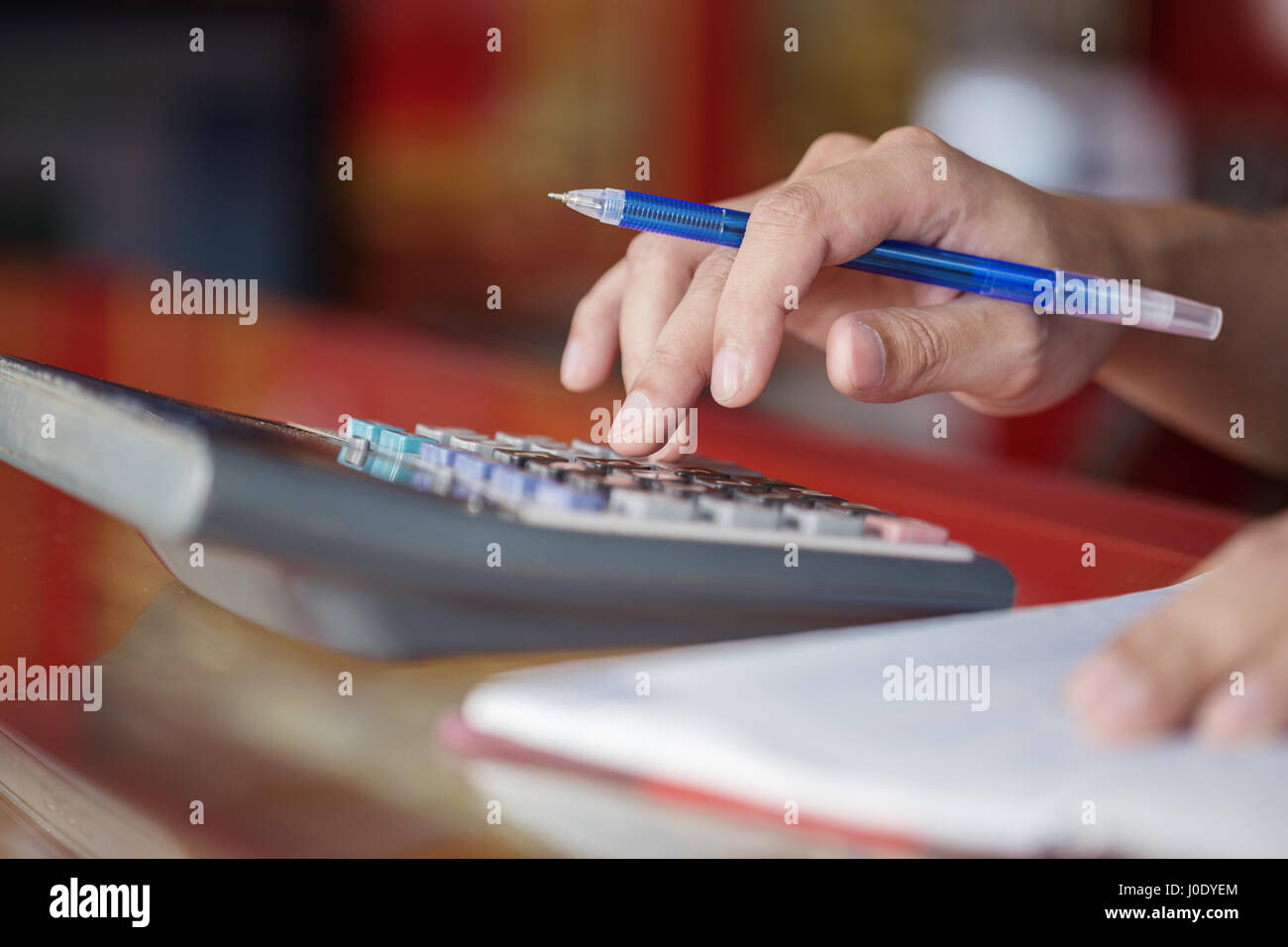 Man hands counting on calculator hi-res stock photography and images ...