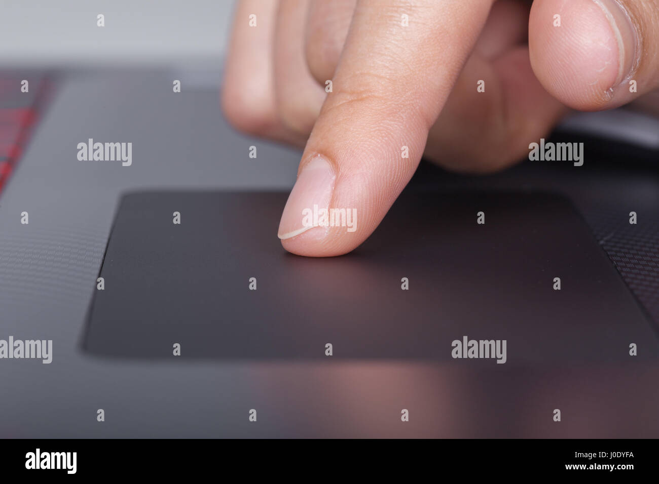 business hand working on a laptop of touchpad Stock Photo - Alamy