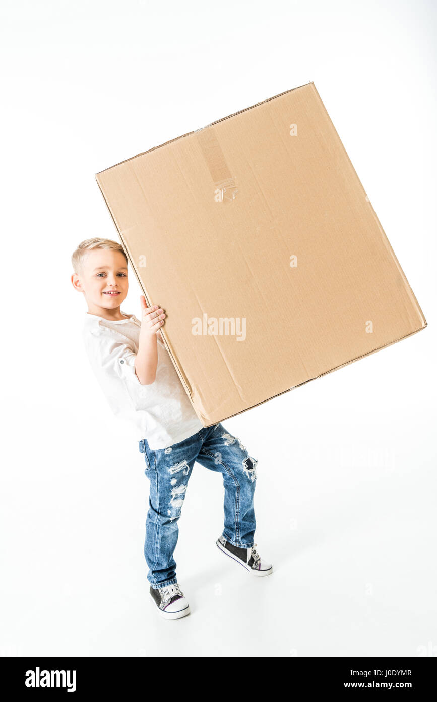 Cute little boy holding cardboard box on white Stock Photo - Alamy