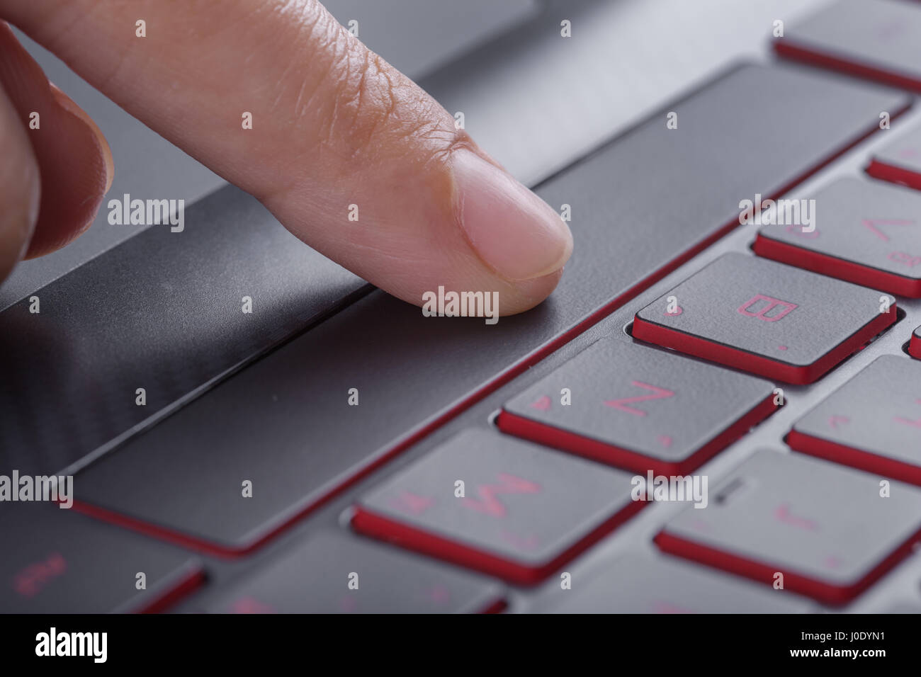 finger pushing space bar button on a laptop keyboard Stock Photo - Alamy