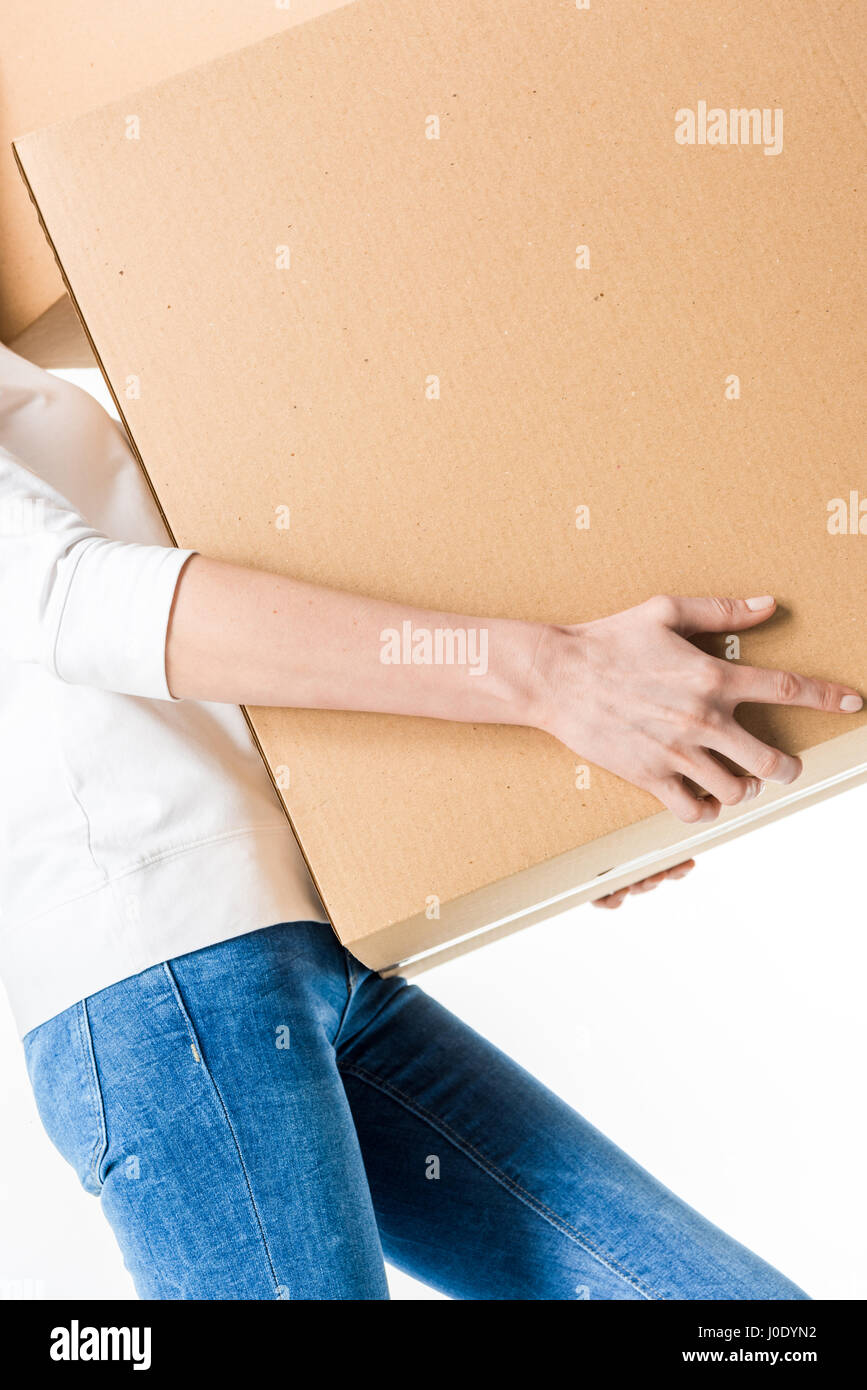 Close-up partial view of young woman holding boxes on white Stock Photo ...