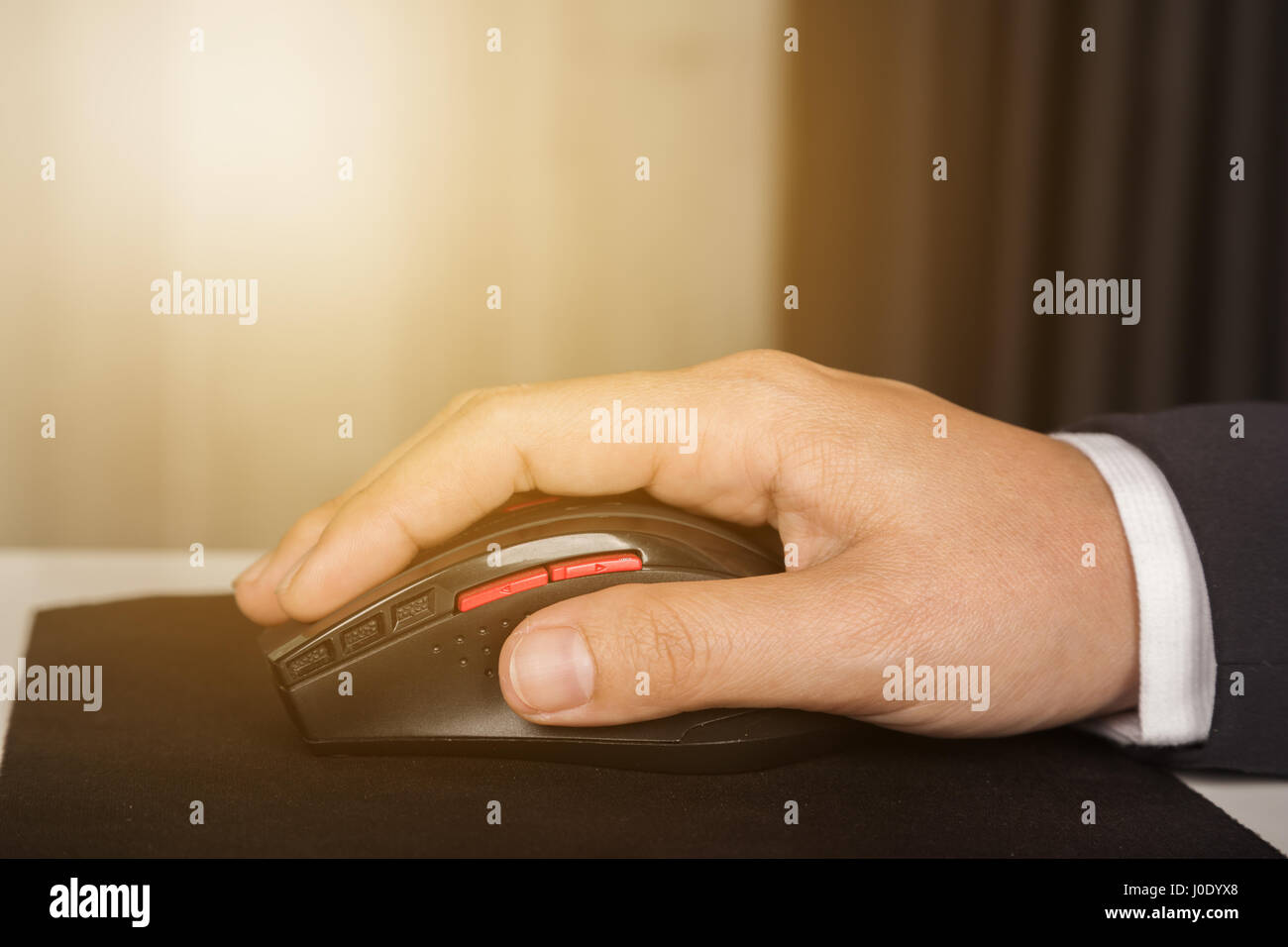 business hand working with mouse of computer with sunlight Stock Photo ...