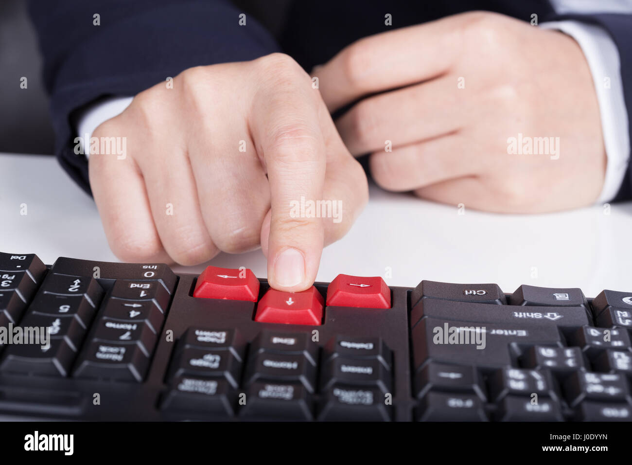 finger pushing arrow button on a keyboard computer Stock Photo - Alamy