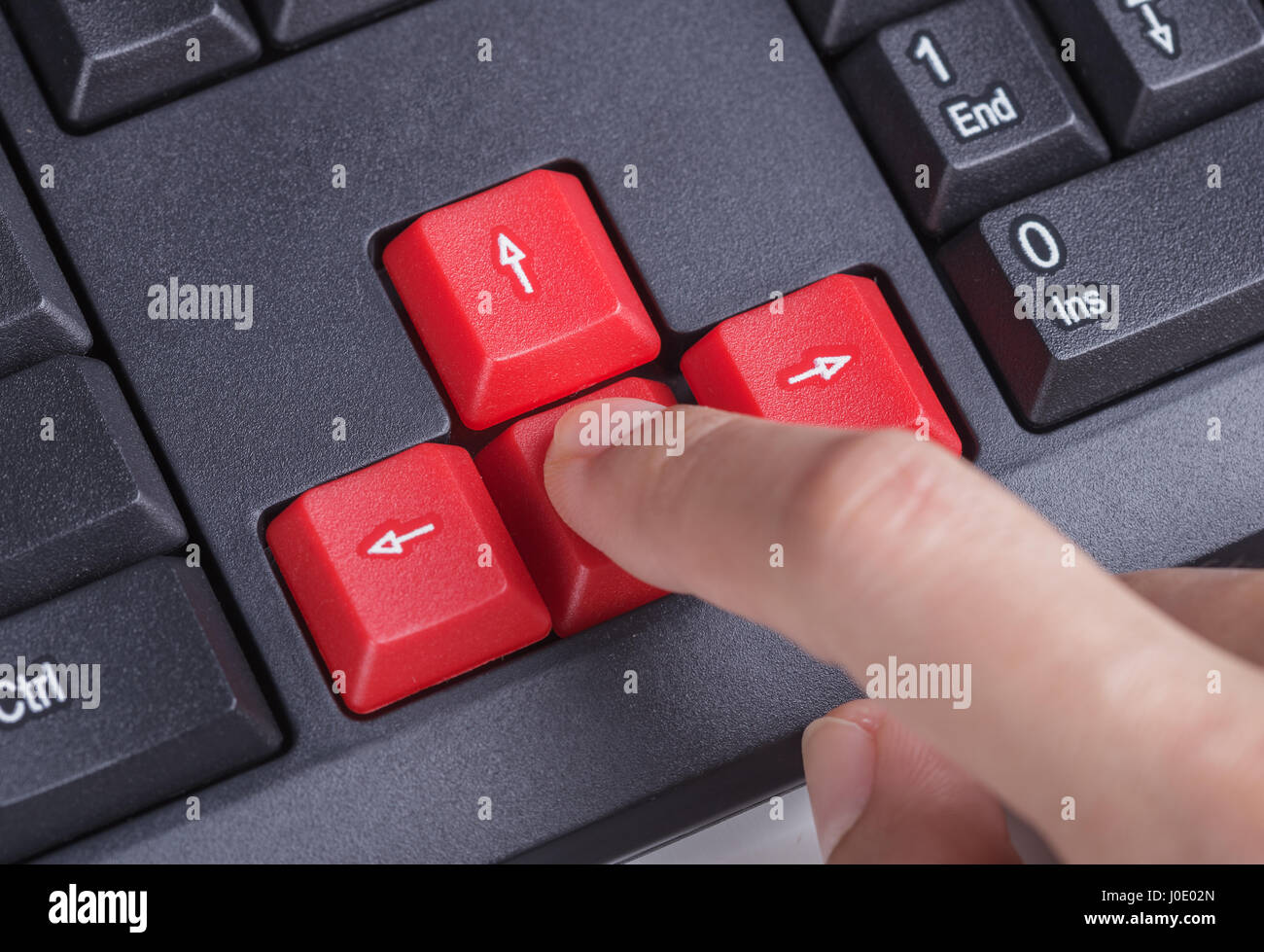 finger pushing arrow button on a keyboard computer Stock Photo - Alamy
