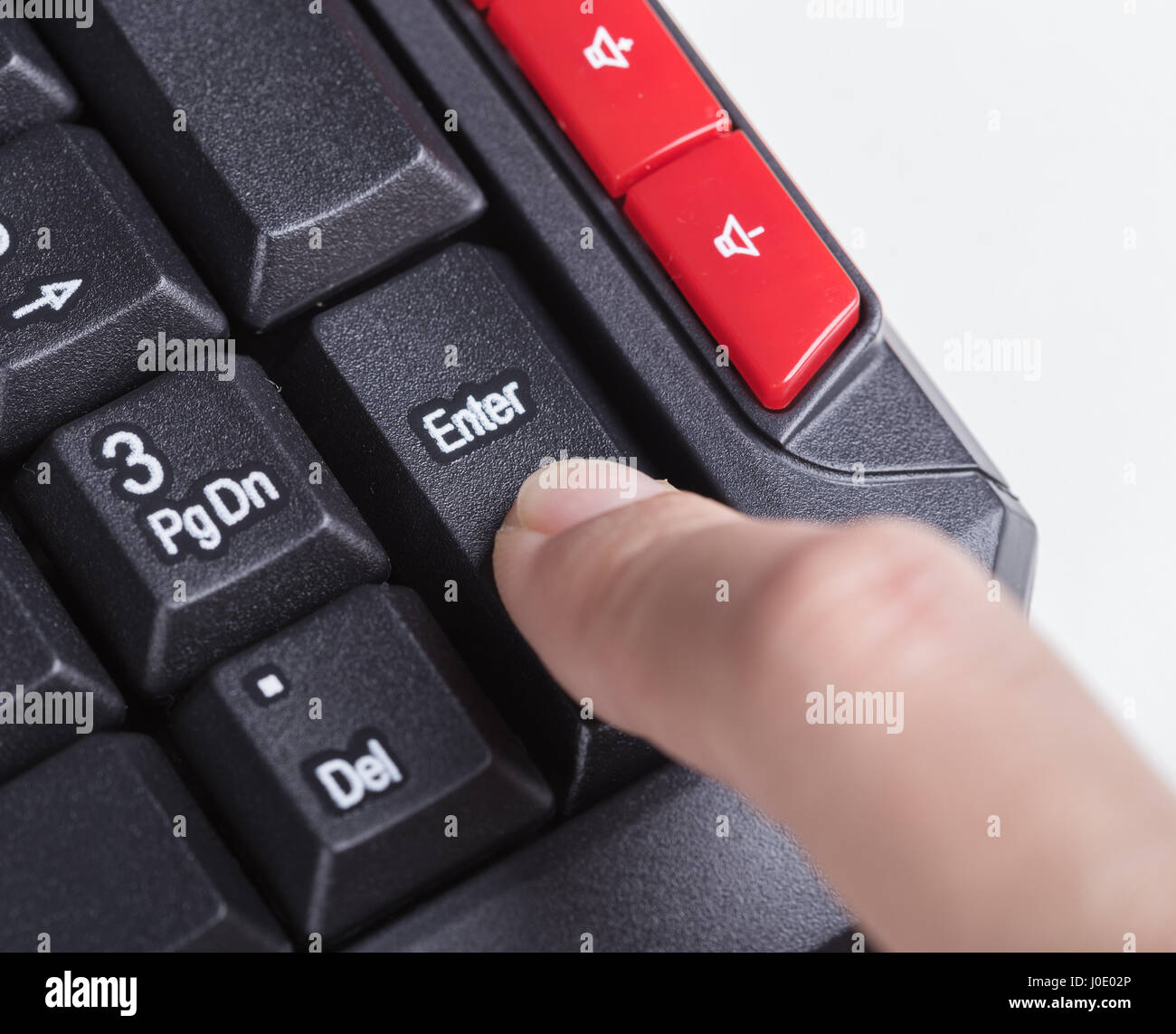 finger pushing enter button on a keyboard of computer Stock Photo - Alamy