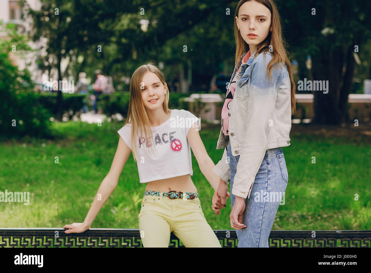 beautiful models pose for a photo in trendy clothes Stock Photo - Alamy