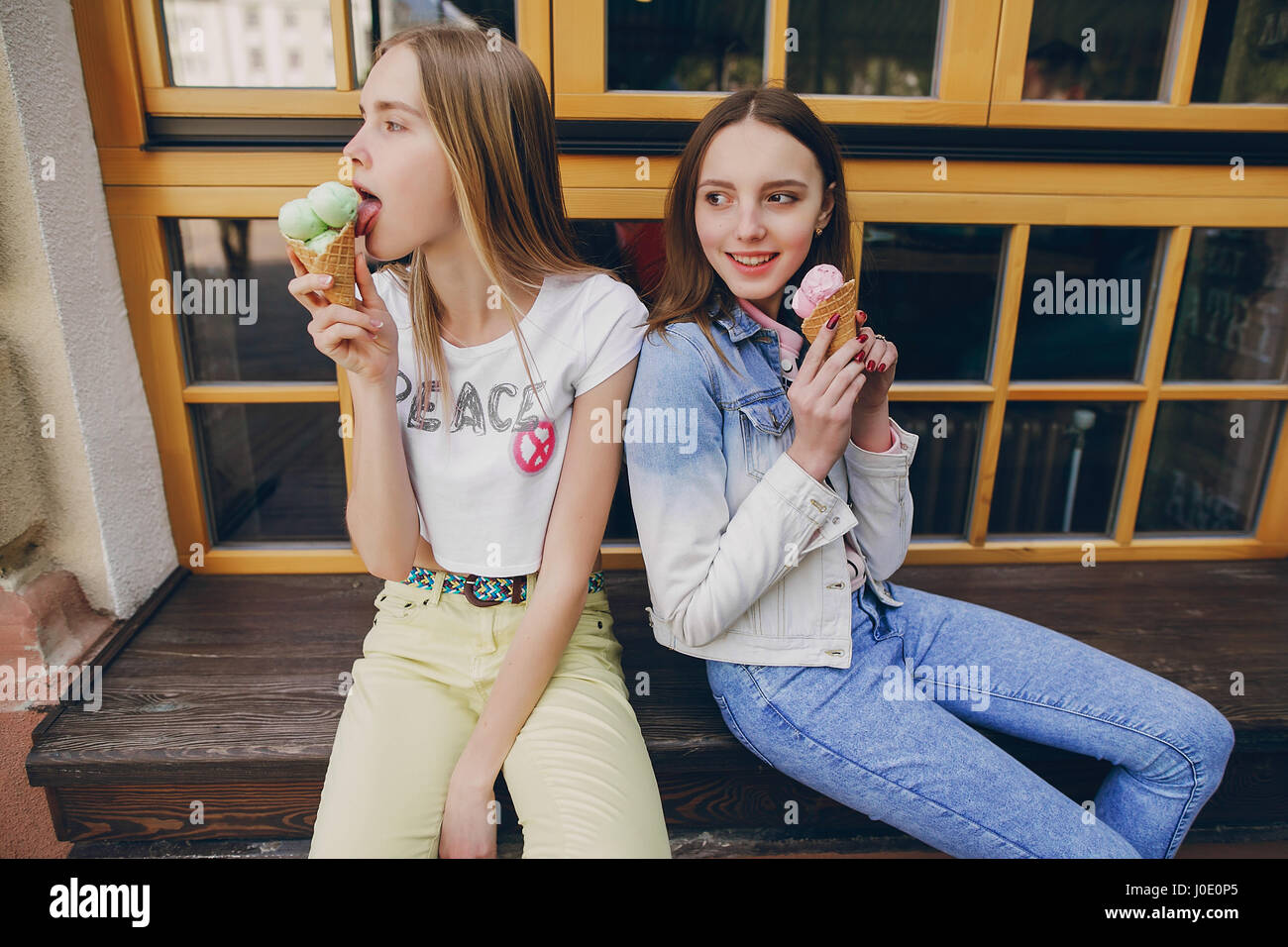 beautiful models pose for a photo in trendy clothes Stock Photo - Alamy