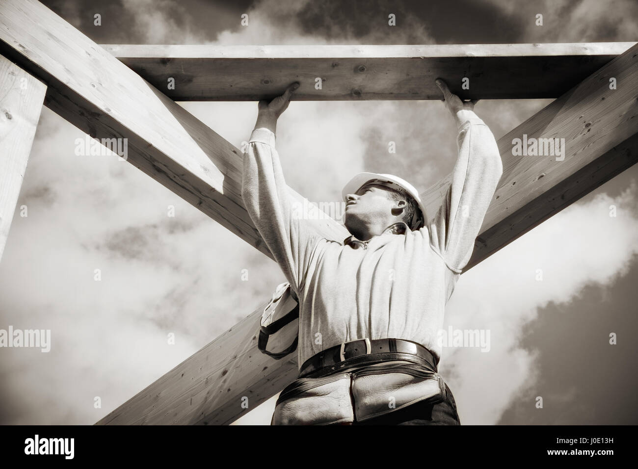 Real carpenter at work with timber.Monochrome Stock Photo - Alamy