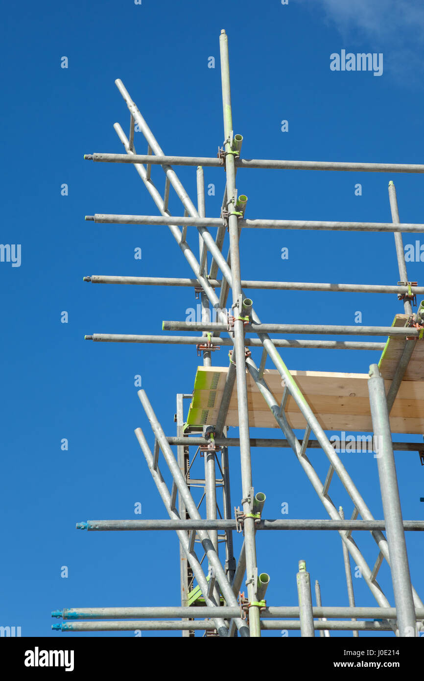 scaffolding construction with blue sky Stock Photo - Alamy
