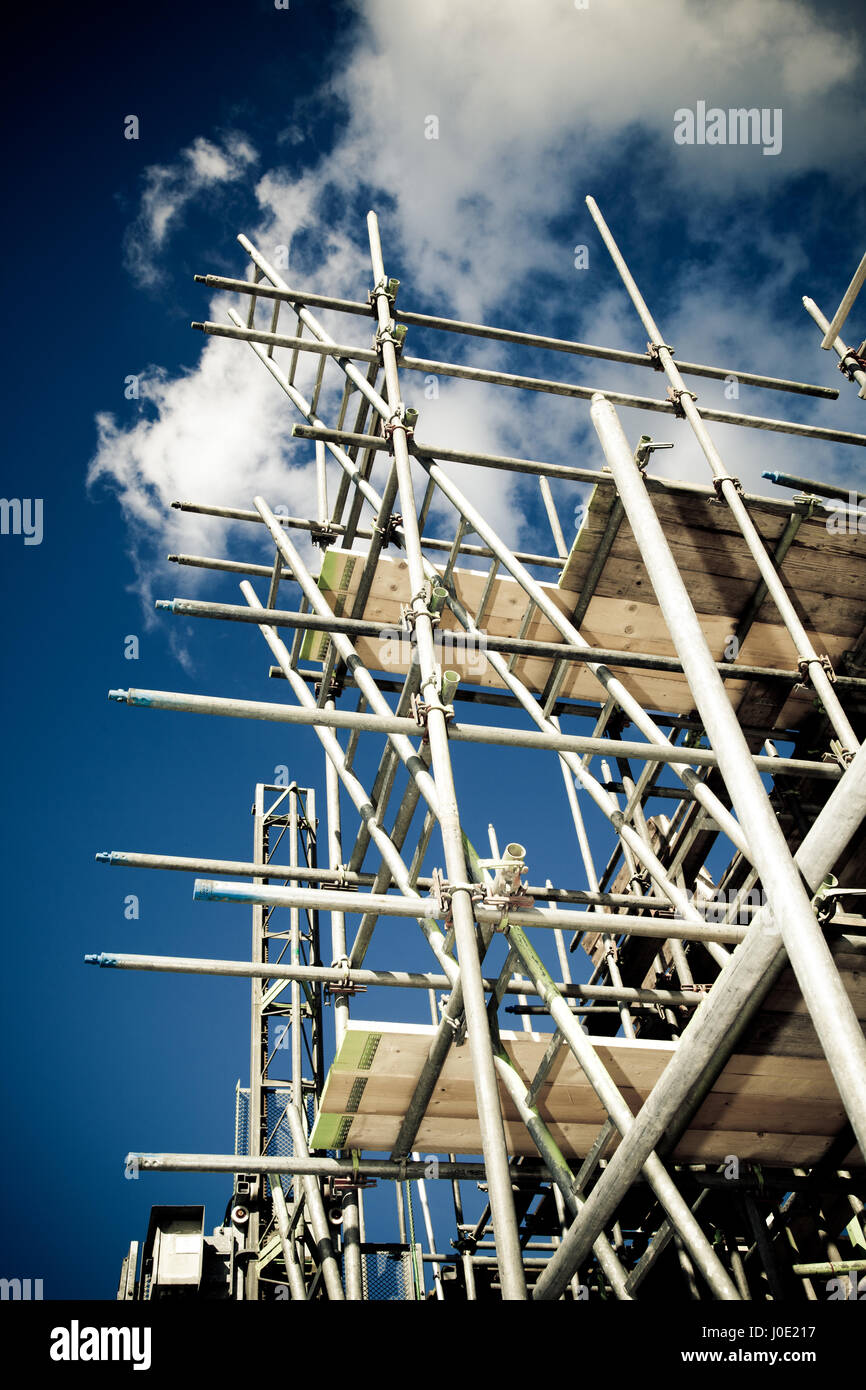 scaffolding construction with blue sky Stock Photo - Alamy