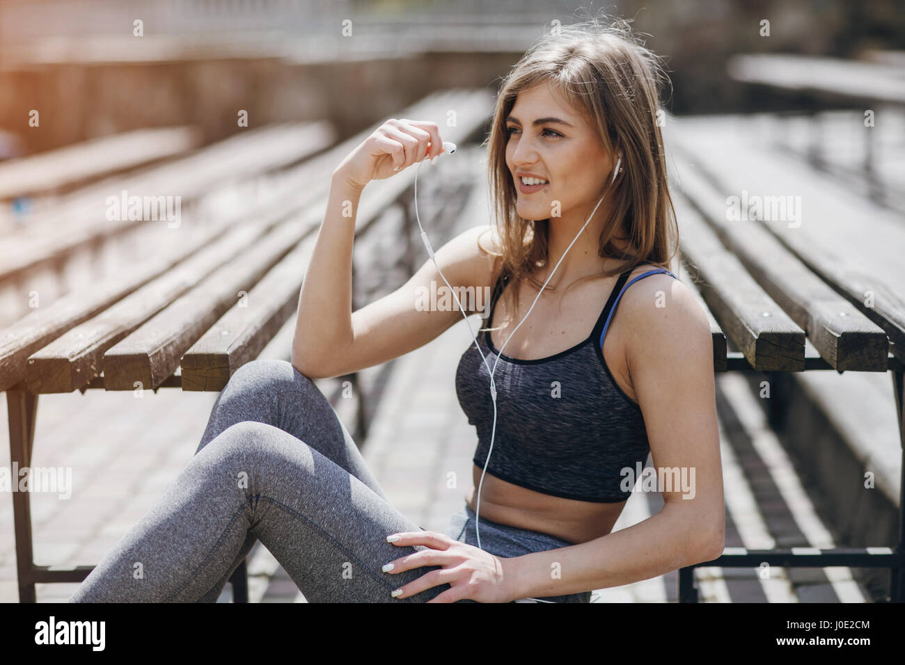 athletic girl running in the Park and doing exercises Jogging Stock ...