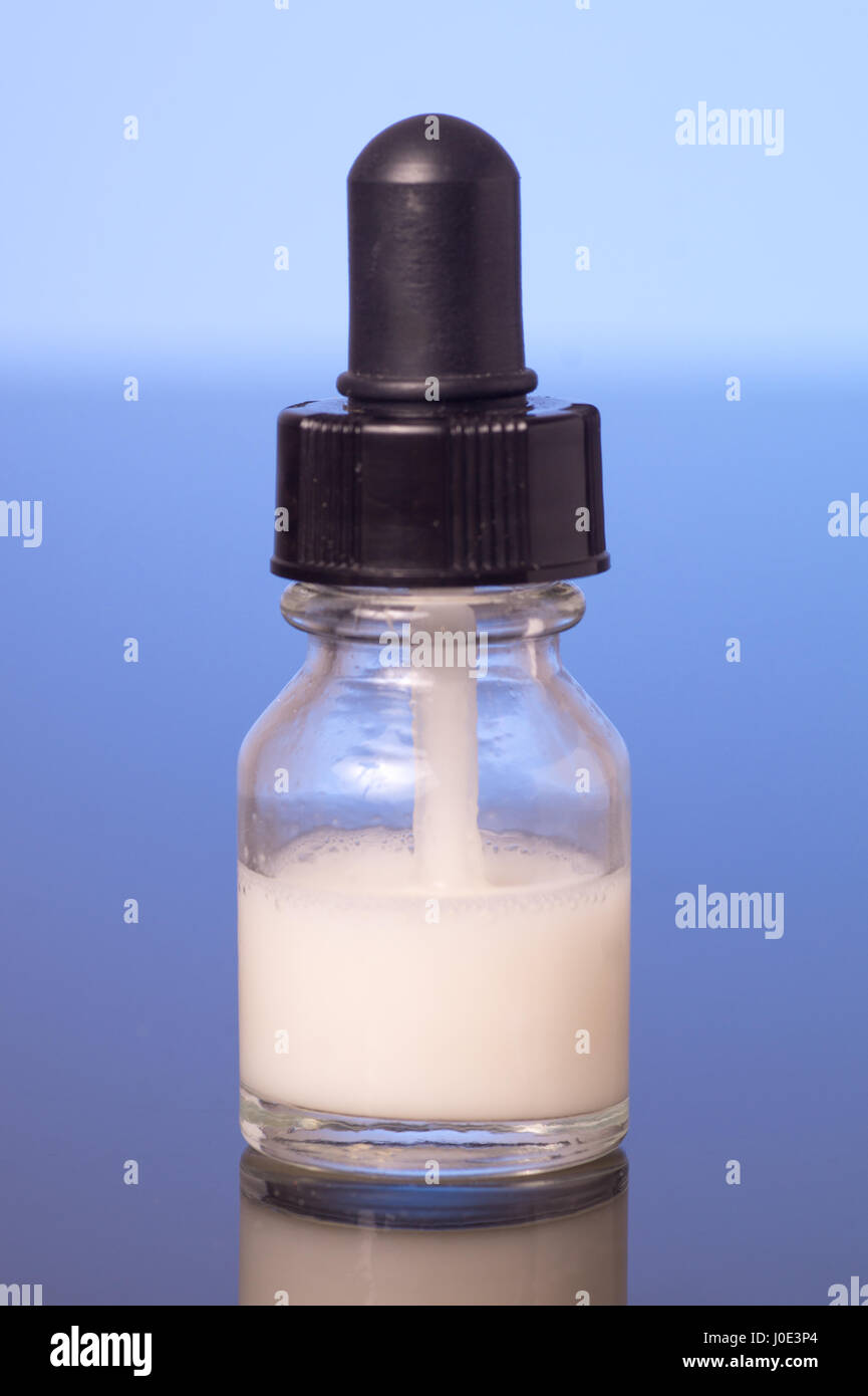 dropper bottle with milk white liquid, isolated Stock Photo - Alamy