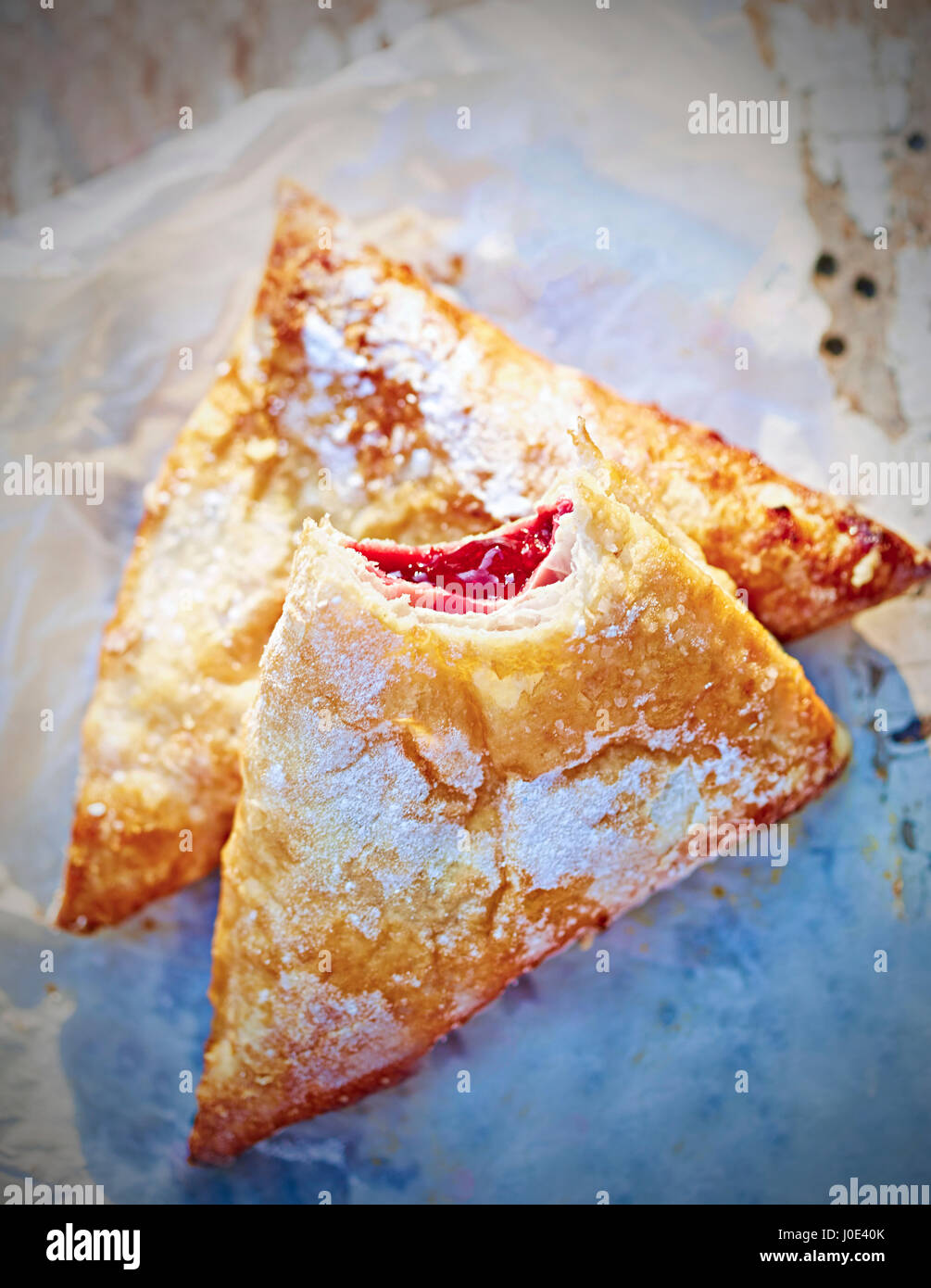 Blueberry puff pastry on white summer table Stock Photo - Alamy