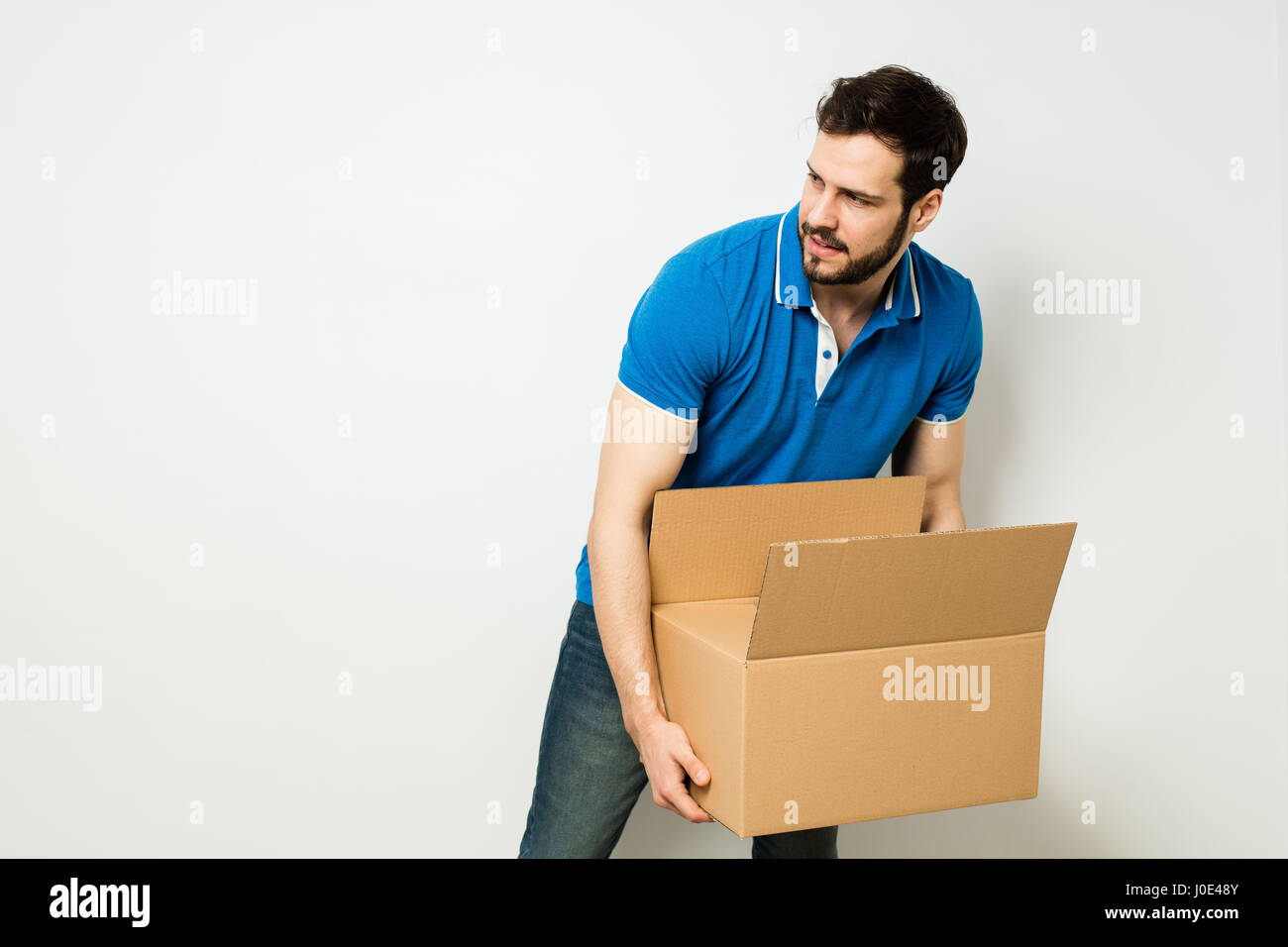 Man carrying a box hi-res stock photography and images - Alamy