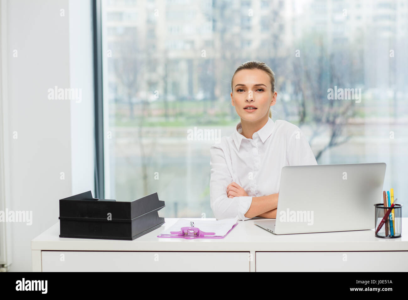 Boss sitting behind desk hi-res stock photography and images - Alamy