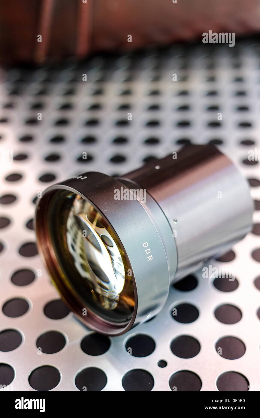 Vintage professional projection movie lens on metalic background Stock ...