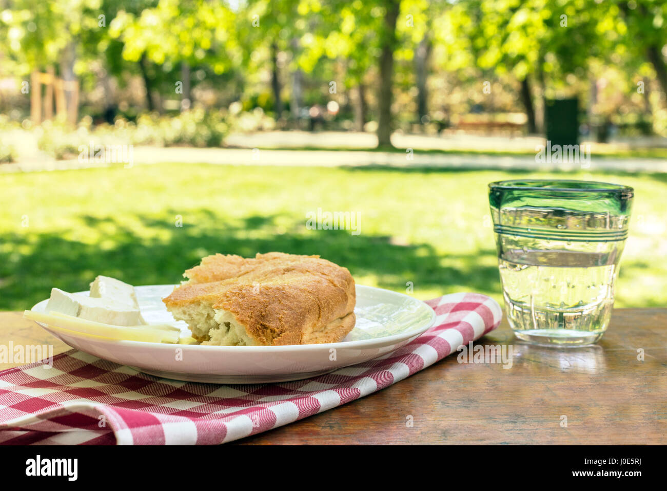 Summer picnic in a park with bread and cheese Stock Photo - Alamy