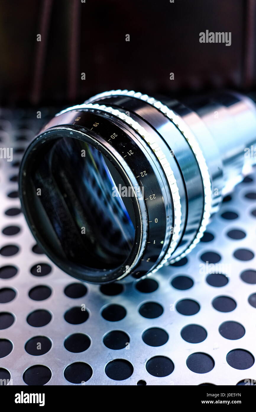 Vintage professional projection movie lens on metalic background Stock ...