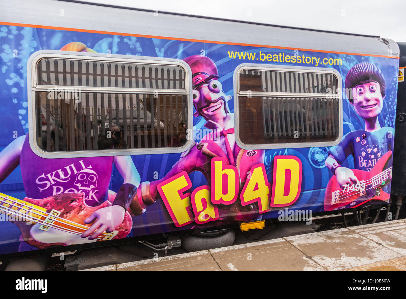 Merseyrail electric train covered in Beatles logos Stock Photo - Alamy