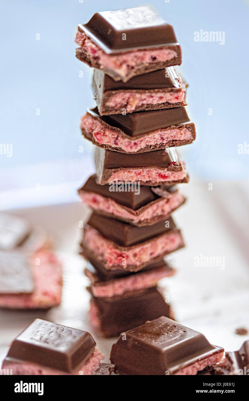 Stack of raspberry chocolate squares Stock Photo - Alamy