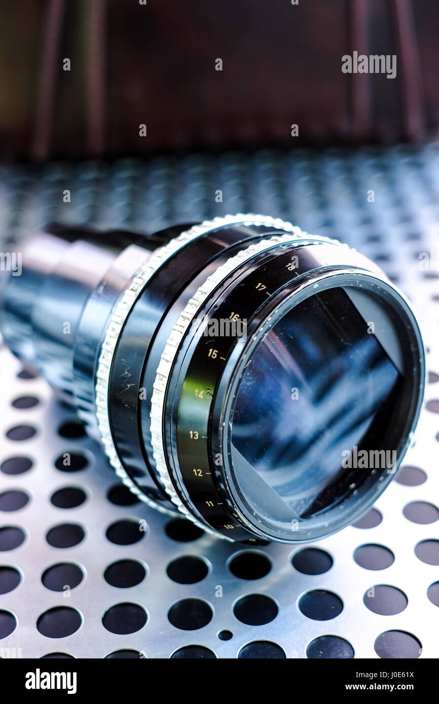 Vintage professional projection movie lens on metalic background Stock ...