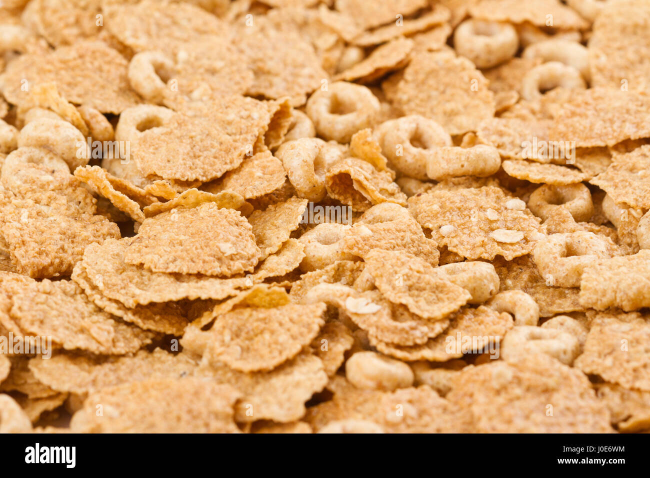 low angle background texture of pile of oat brown breakfast cereals ...