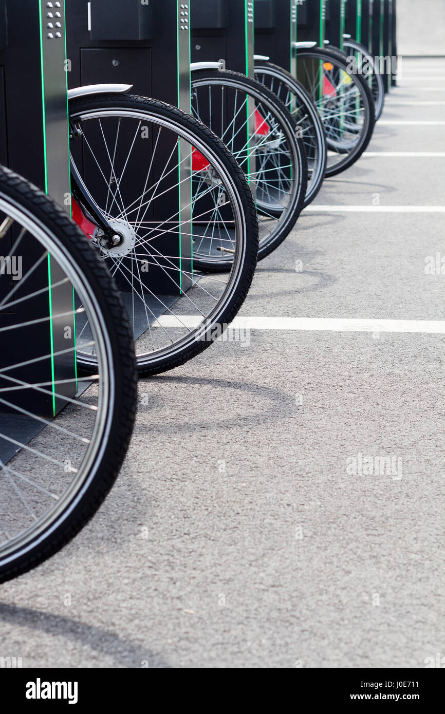 vertical perspective view of city bike stand with row of bicycles for ...
