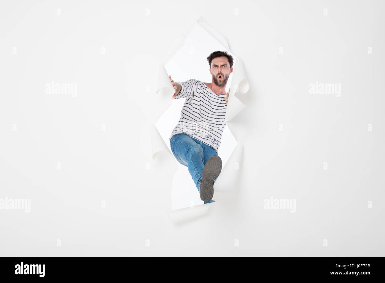 Businessman breaking out wall hi-res stock photography and images - Alamy