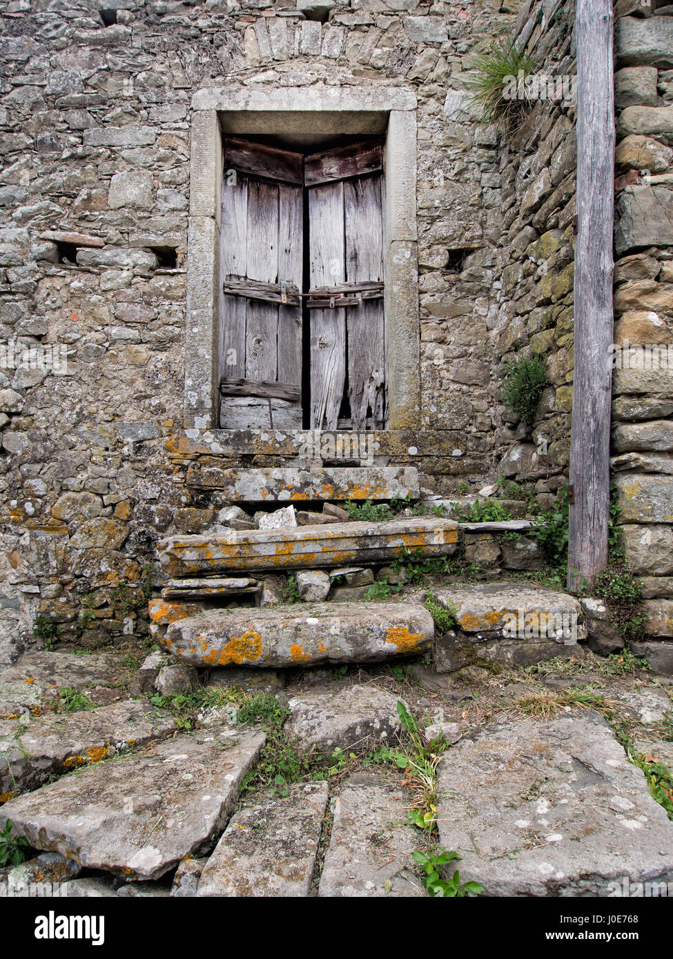 Old steps with reuse of even older carved stone Stock Photo - Alamy