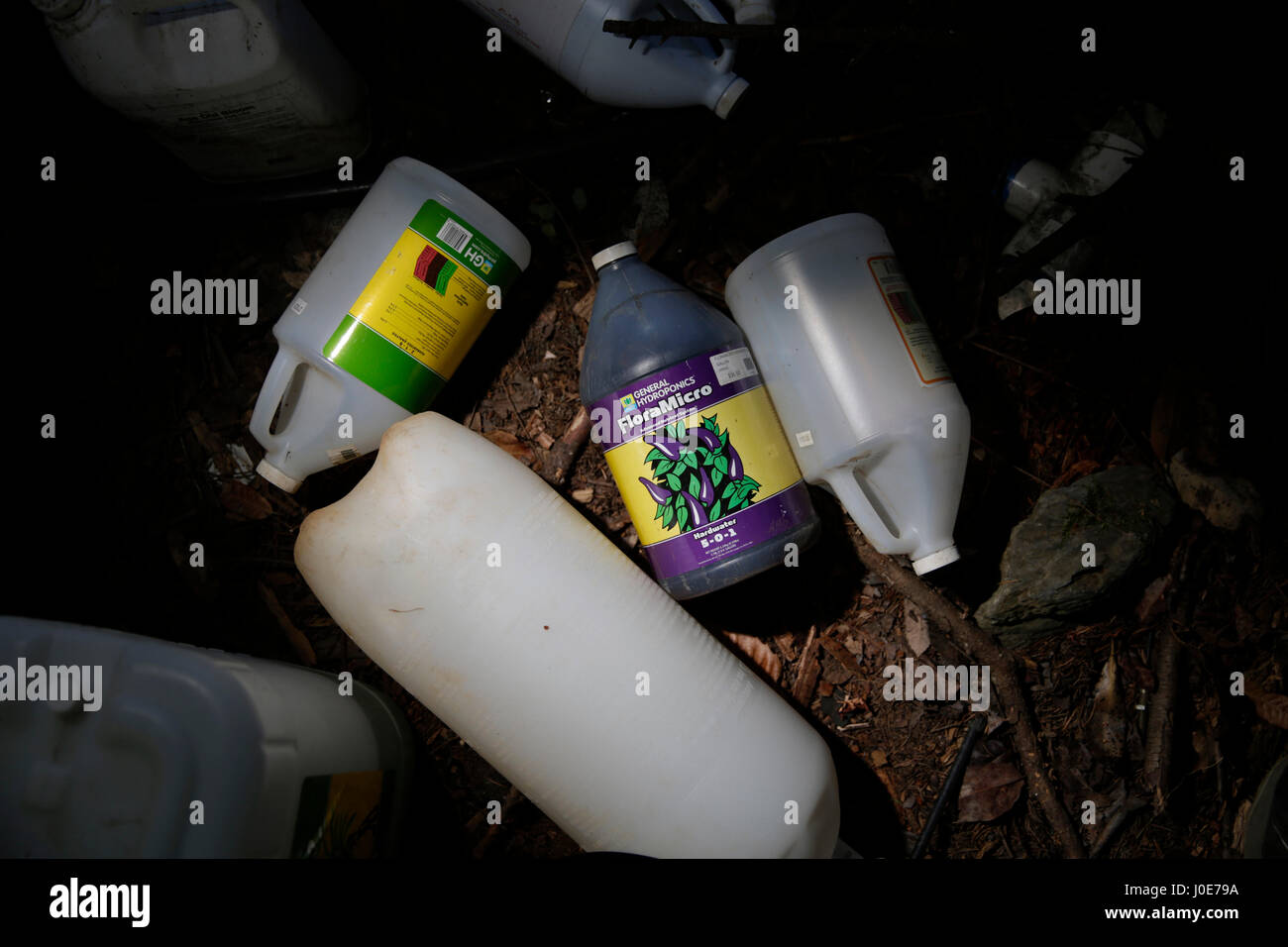 Containers for agricultural chemicals are seen on a marijuana farm on ...