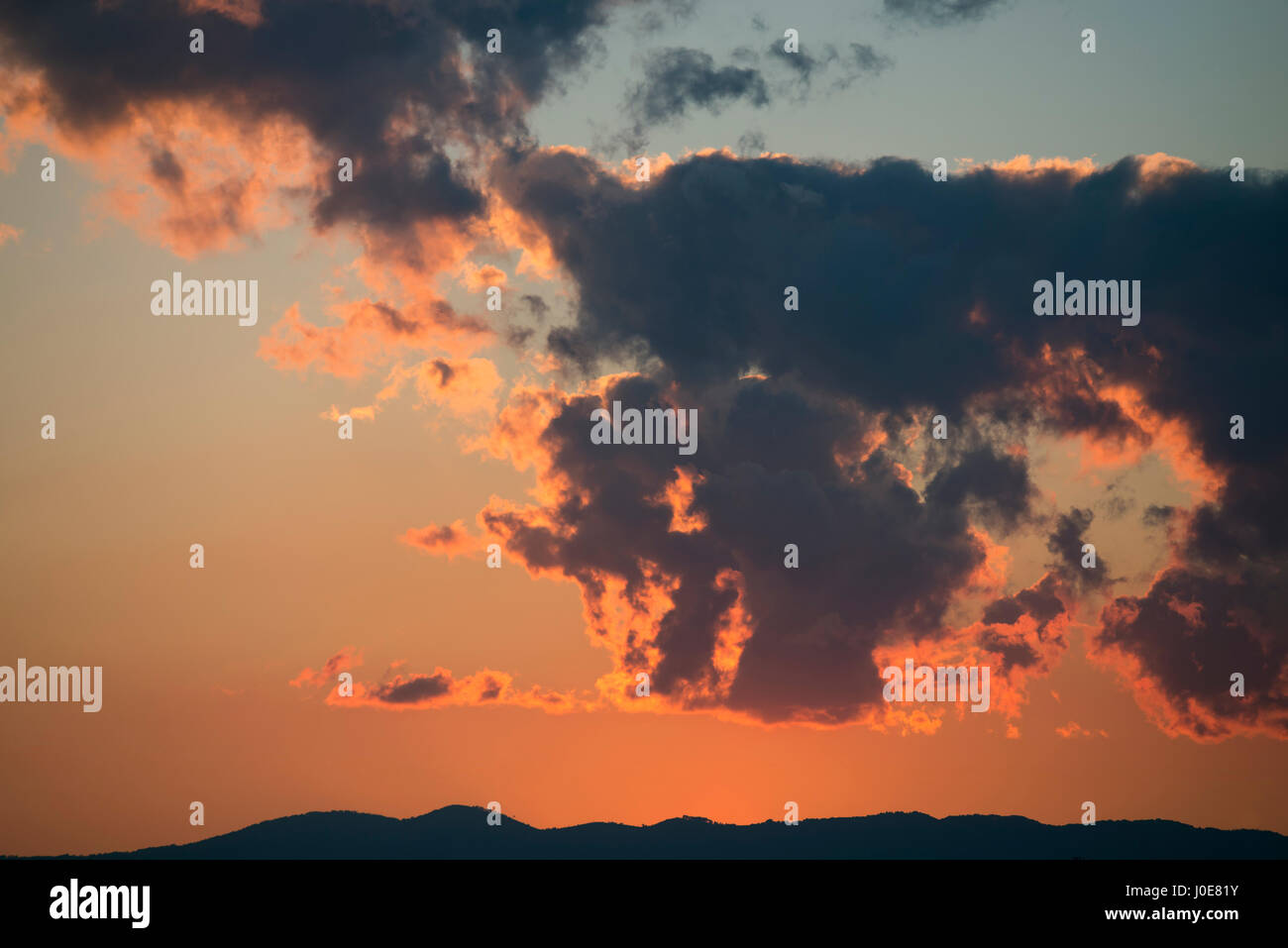 Clouds on sunset sky background Stock Photo - Alamy