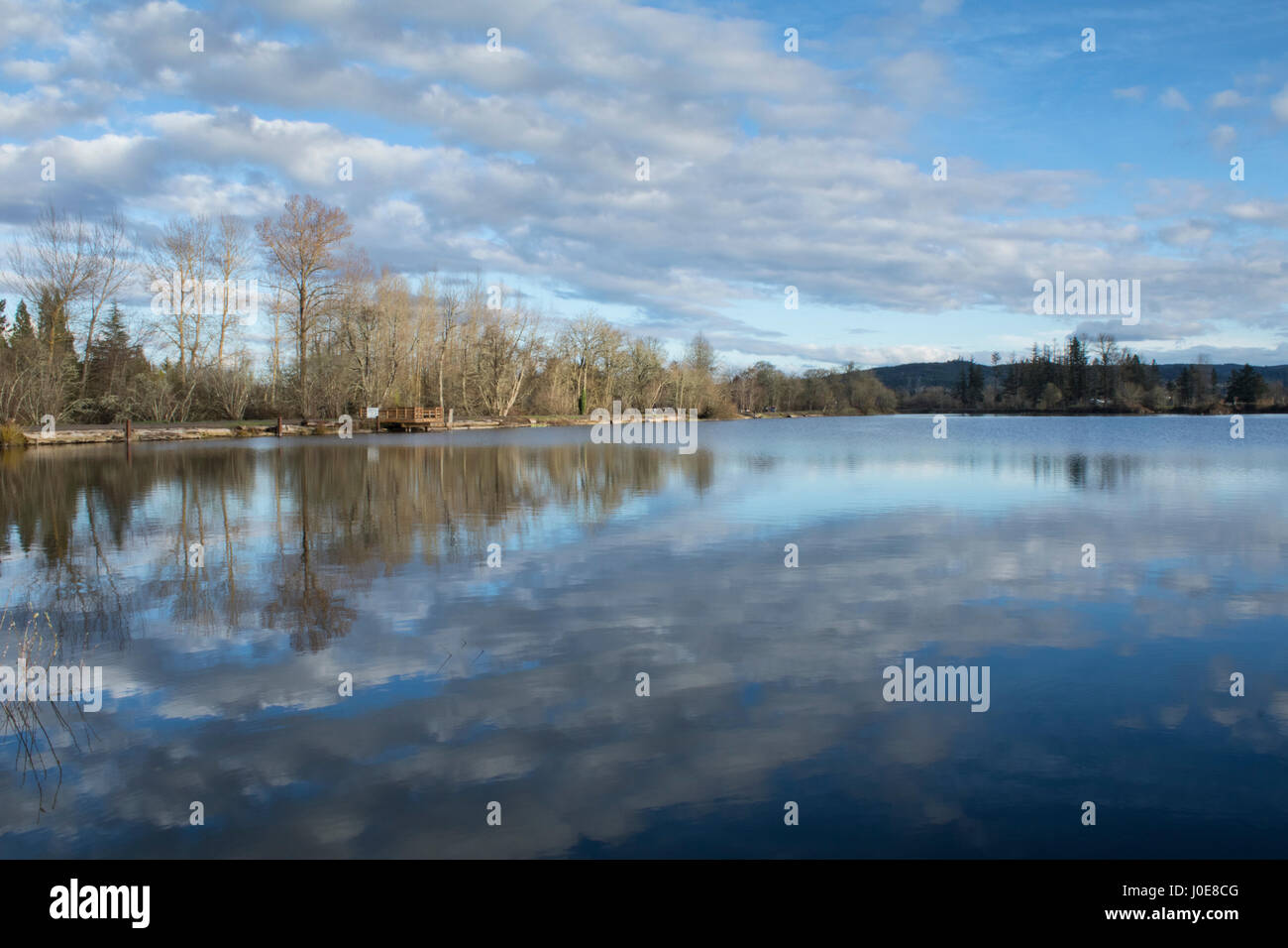 The dramatic sky is reflected in Cheadle Lake, a reclaimed mill pond in ...