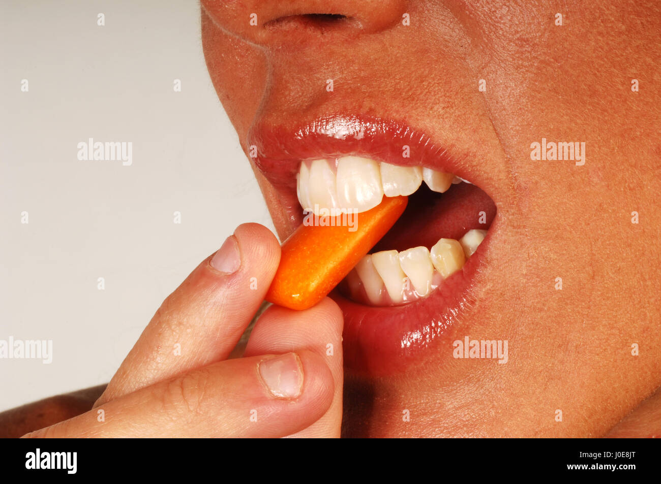 Woman eat with bubble gum on her face Stock Photo - Alamy