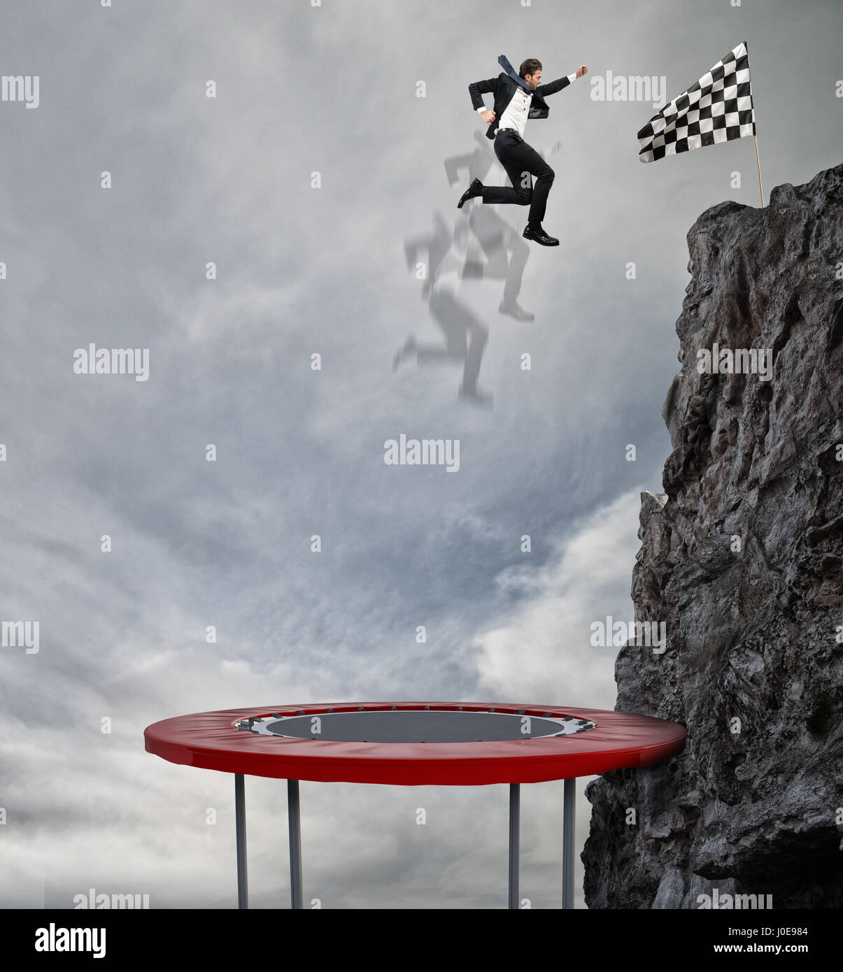 Businessman jumping on a trampoline to reach the flag. Achievement ...