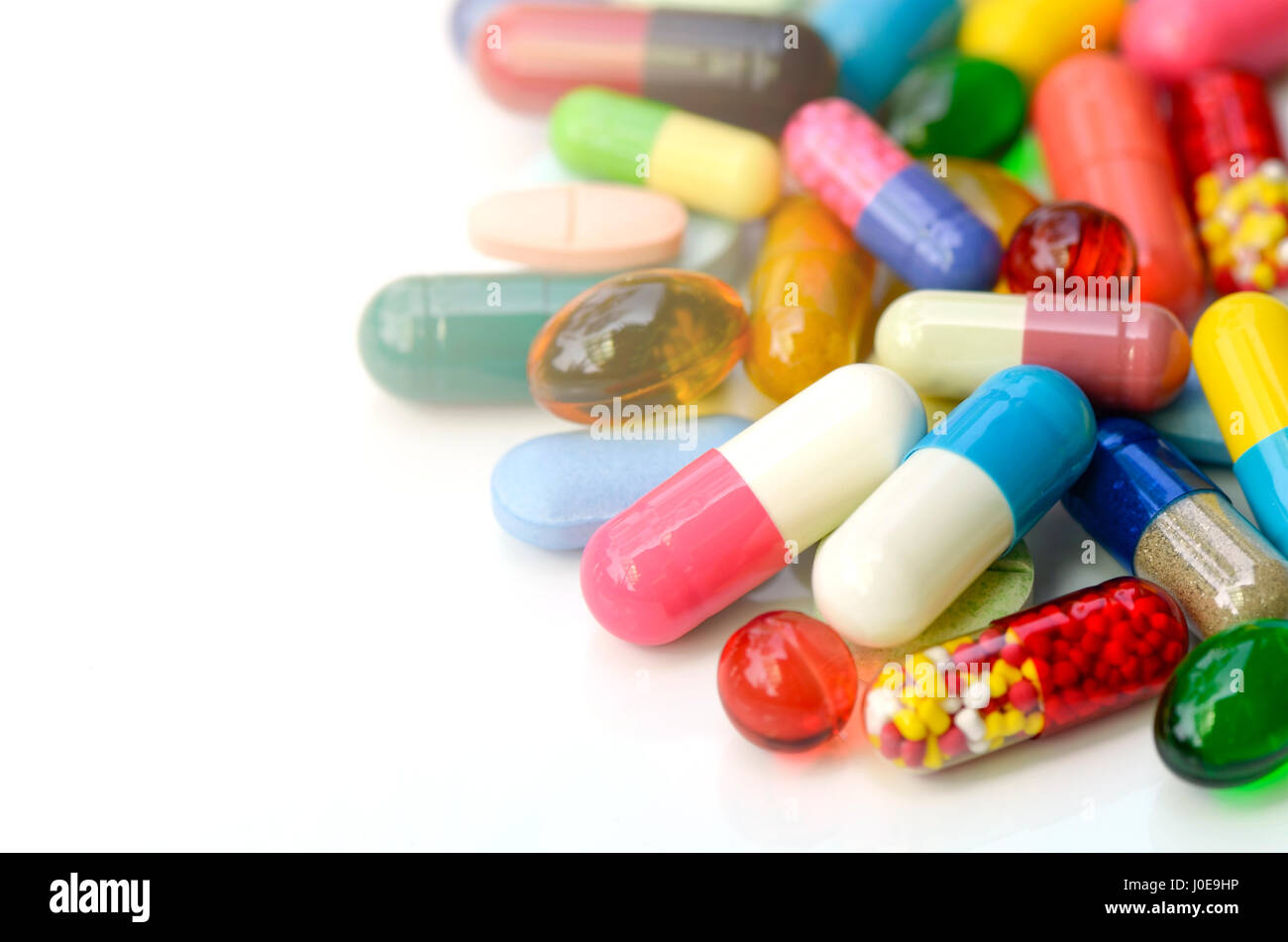 Colorful of oral medications on White Background Stock Photo - Alamy