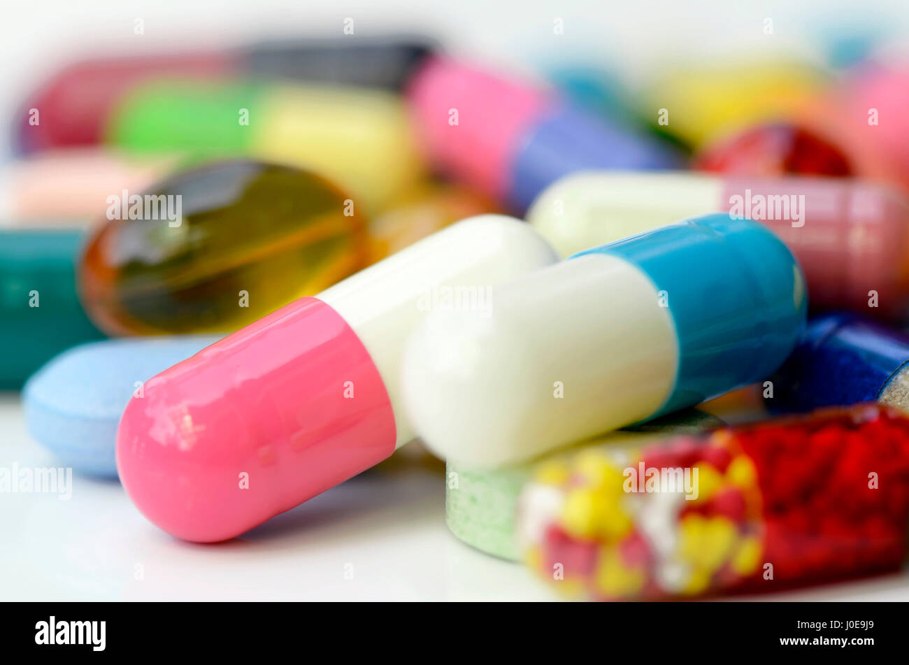 Colorful of oral medications on White Background Stock Photo - Alamy