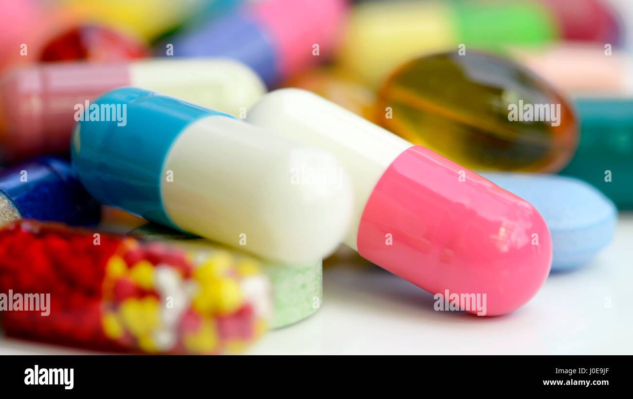 Colorful of oral medications on White Background Stock Photo - Alamy