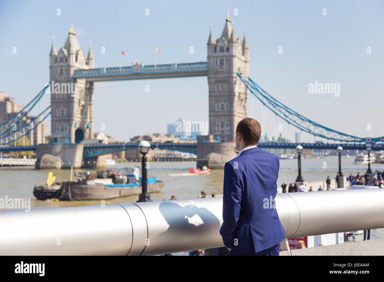 Businessman on phone tower bridge hi-res stock photography and images ...