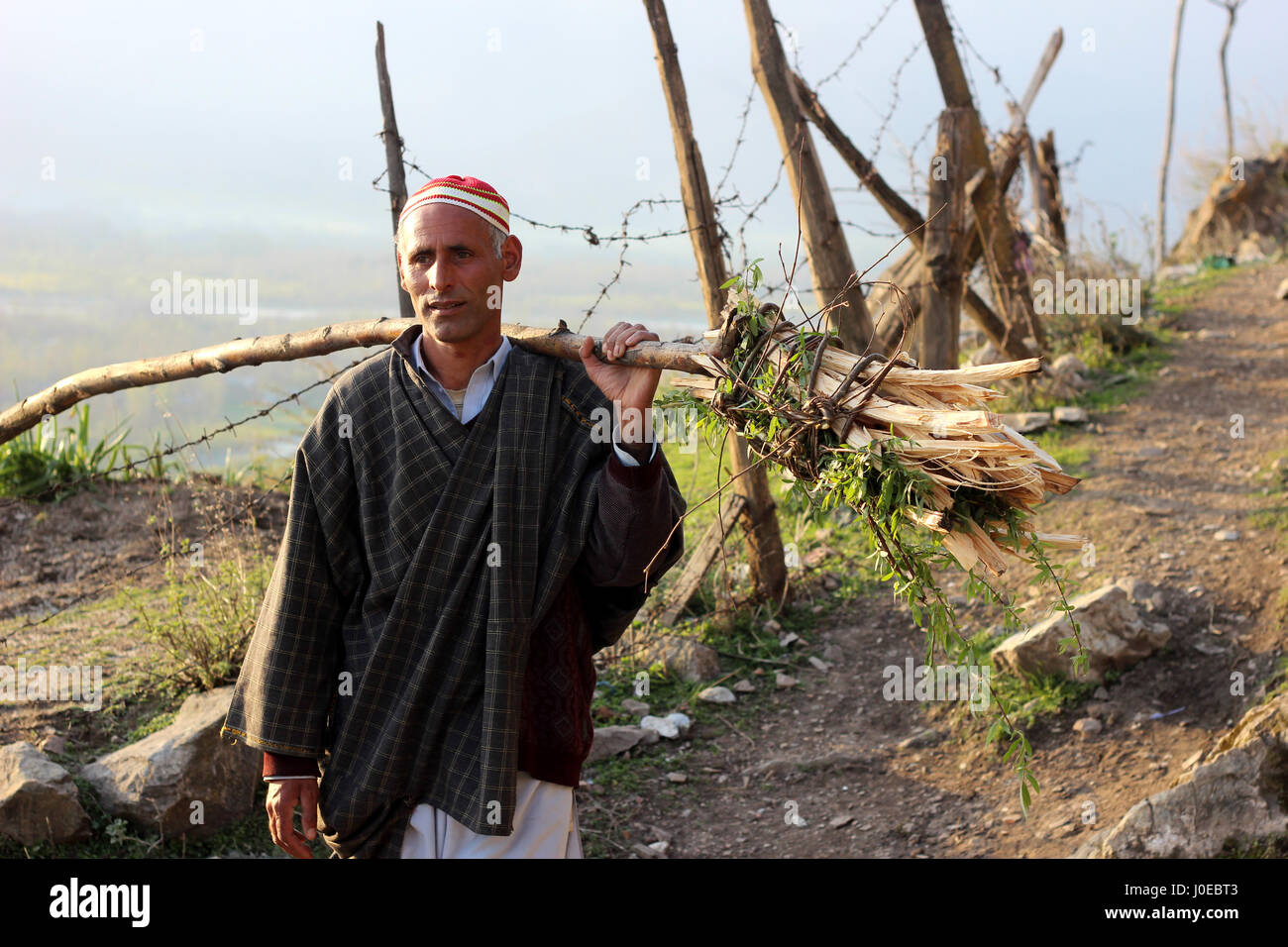 Aishmuqam, Kashmir. 11th Apr, 2017. Kashmiri Muslim villagers carrying ...