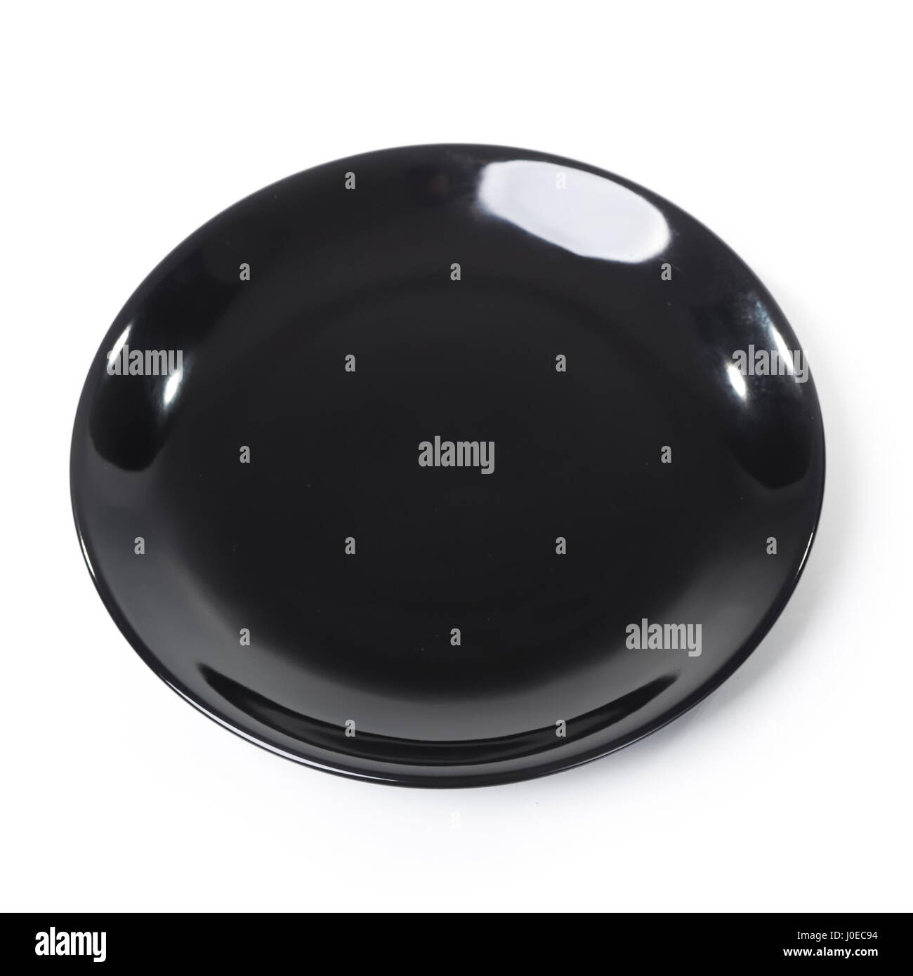 Black plate isolated on white background Stock Photo - Alamy