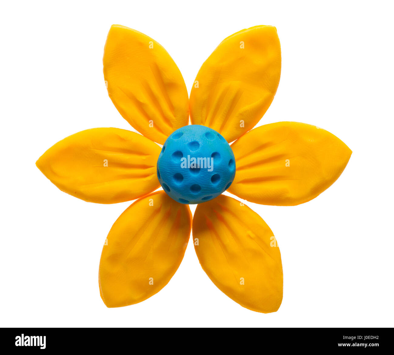 Yellow plasticine flower isolated on white background Stock Photo - Alamy