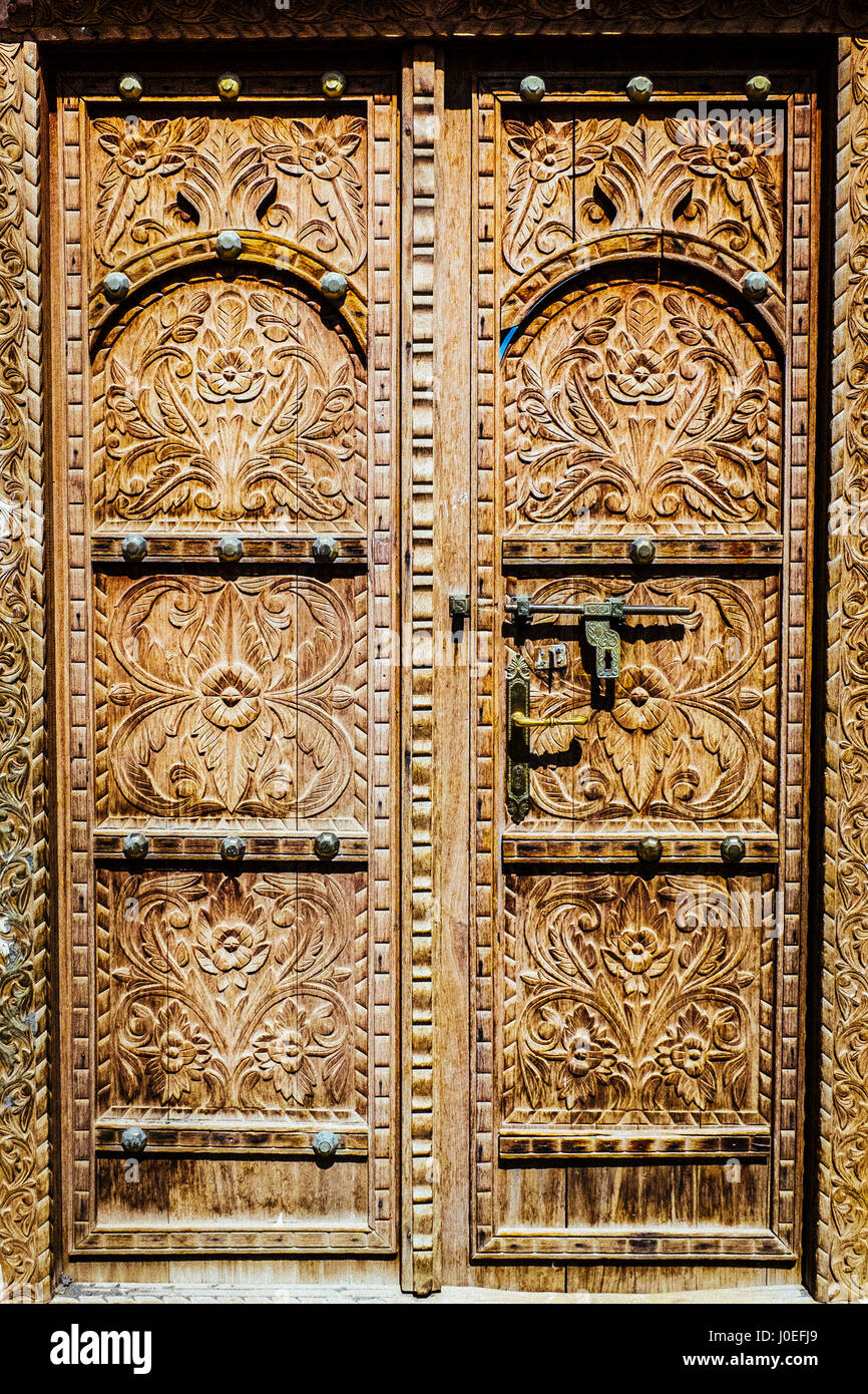 A carved wooden door on the way from Salalah to Muscat, Oman Stock ...