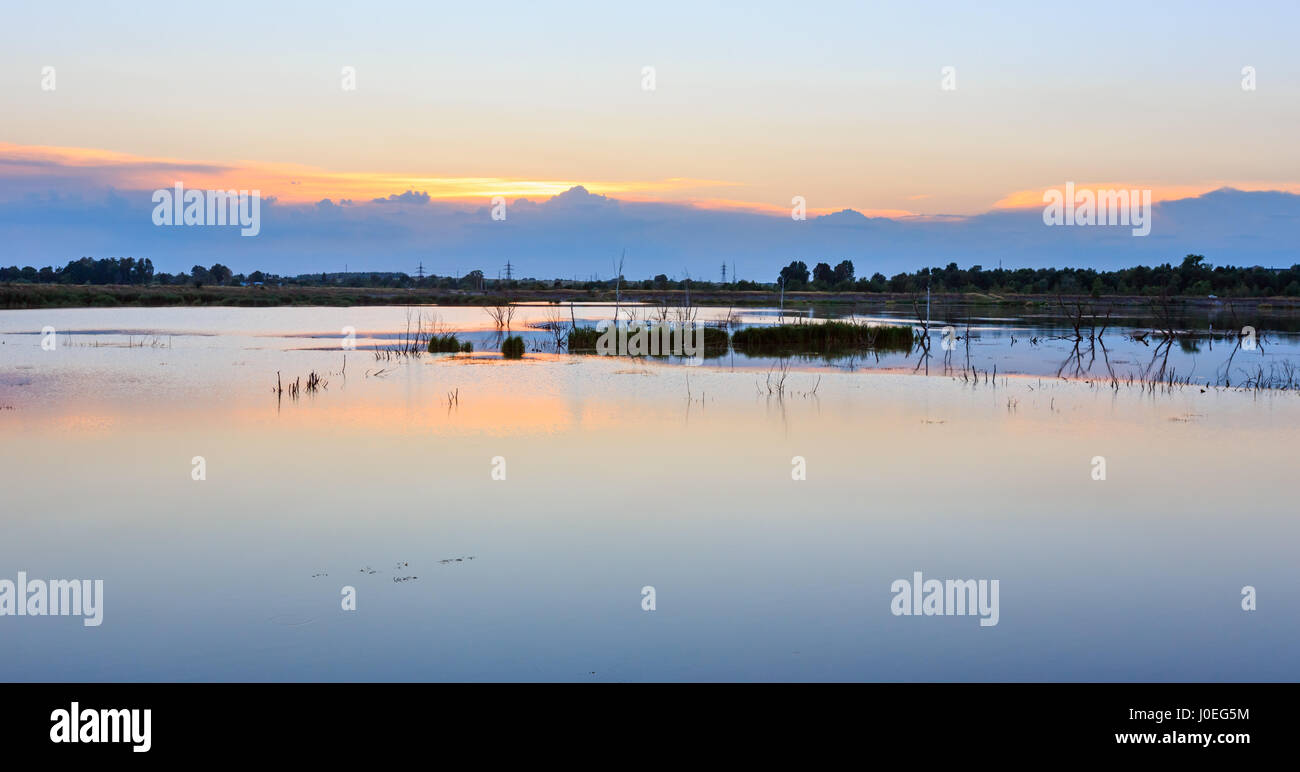 Sunset summer lake landscape with sun reflection on water surface (near ...