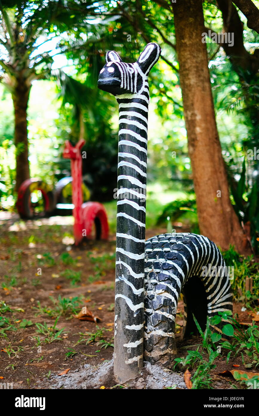 Small animal statue in the children's playground Stock Photo - Alamy