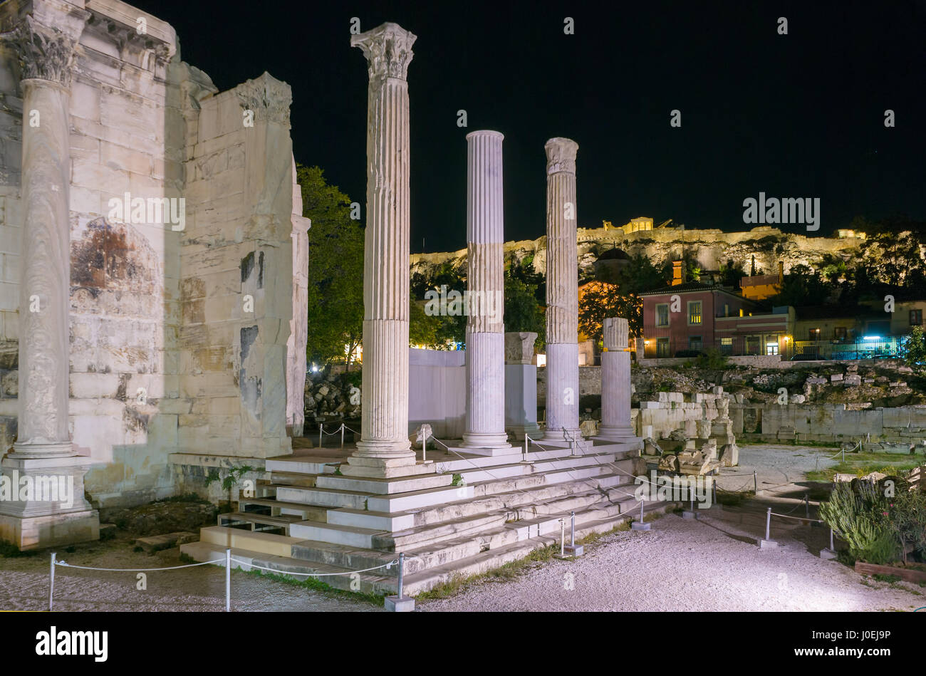 The ruins of Olympian Zeus Temple with Parthenon of the background ...