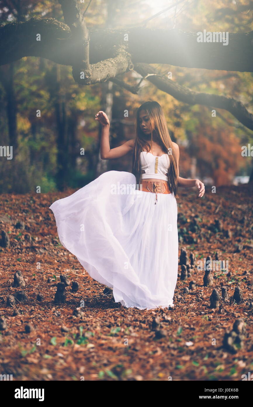 Beautiful wiccan girl dancing in the mystical forest Stock Photo - Alamy